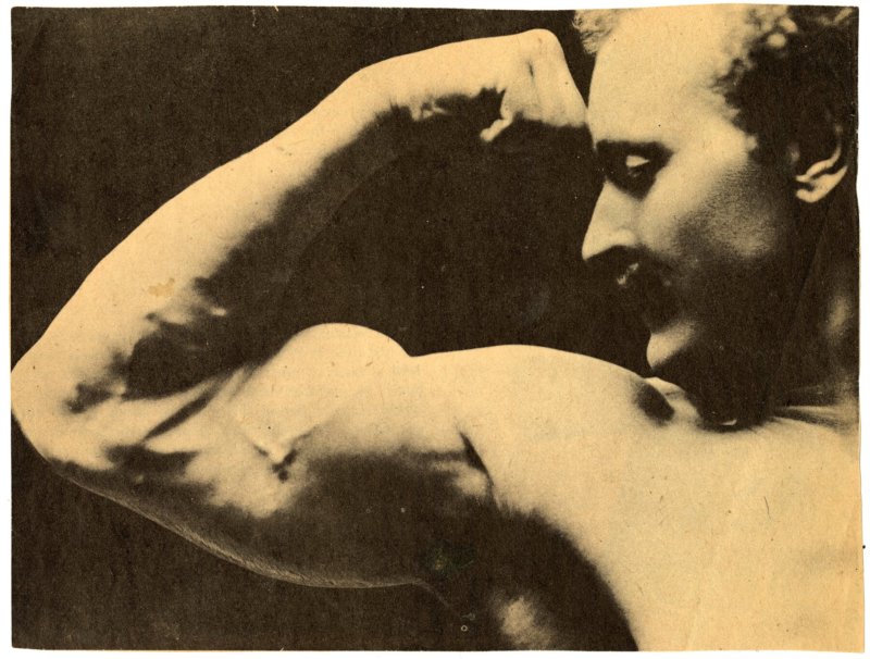 Sandow flexing right biceps, detail | Rogue USA