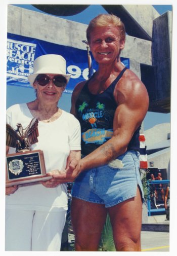 Pudgy Stockton with award and Bill Howard | Rogue Fitness
