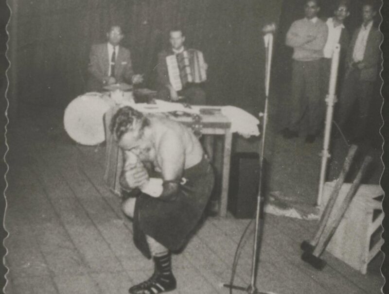 The Mighty Atom performing feat of strength | Rogue Fitness