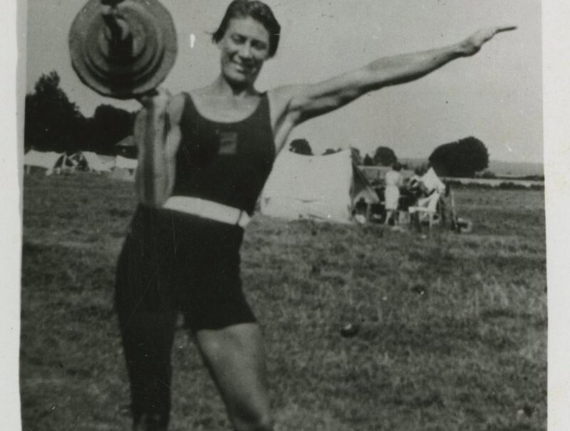 Ivy Russell holding barbell at shoulder | Rogue Fitness