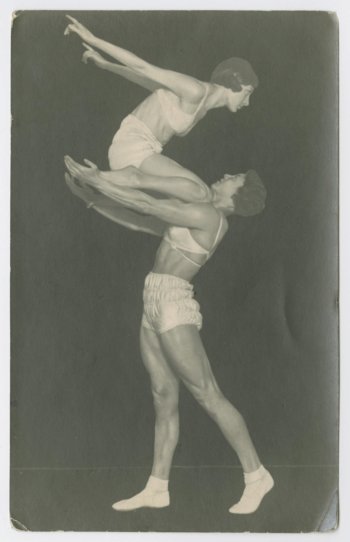 Ivy Russell performing acrobatic feat with partner | Rogue Fitness