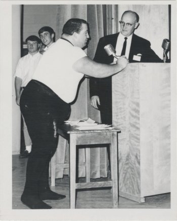 Paul Anderson and Peary Rader at podium | Rogue Fitness