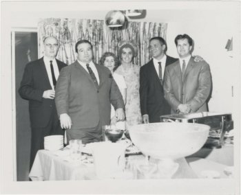 Paul Anderson with Peary Rader, Bill Pearl, and other party attendees ...