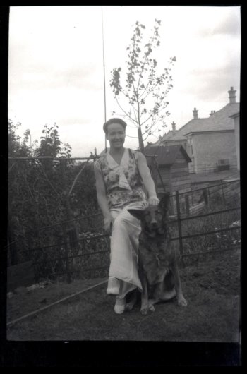 Agnes Clark posing with dog | Rogue Fitness