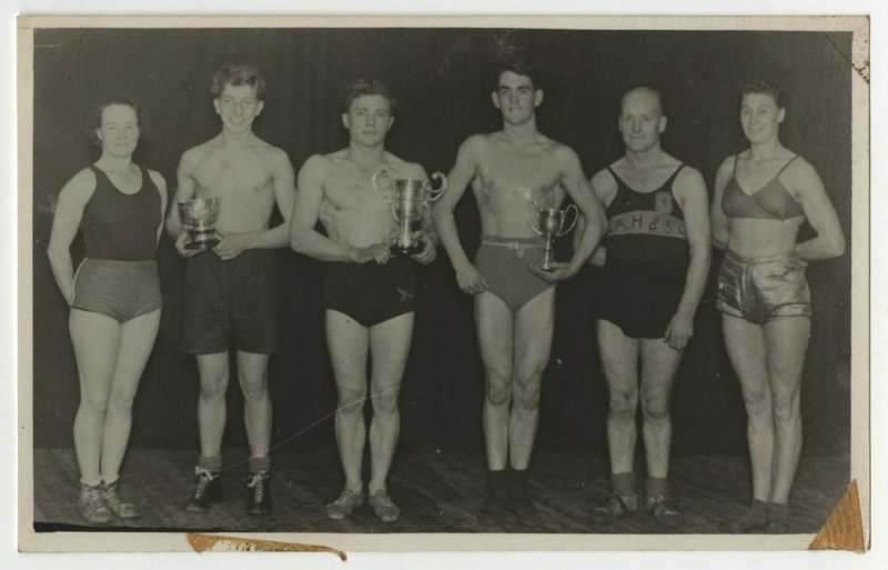 Ivy Russell and Agnes Clark with unidentified men in group photograph ...